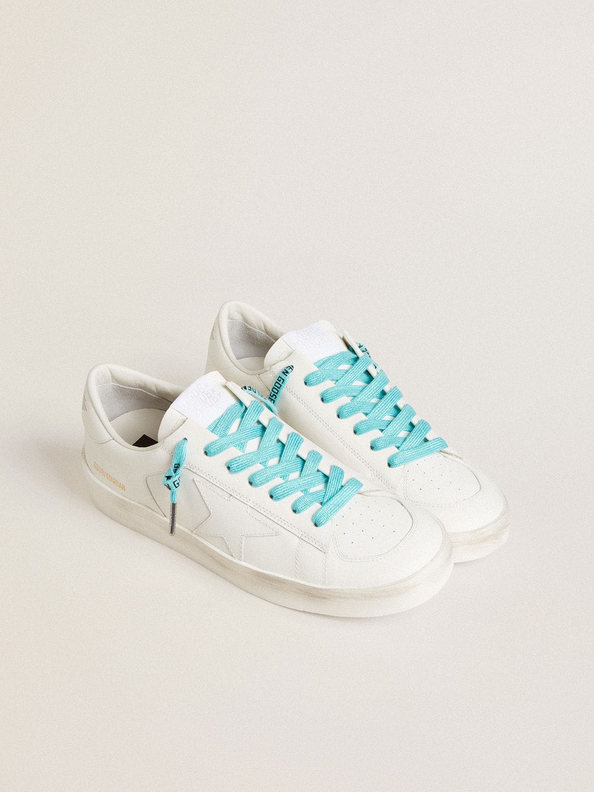 Light blue Lurex laces with contrasting black logo