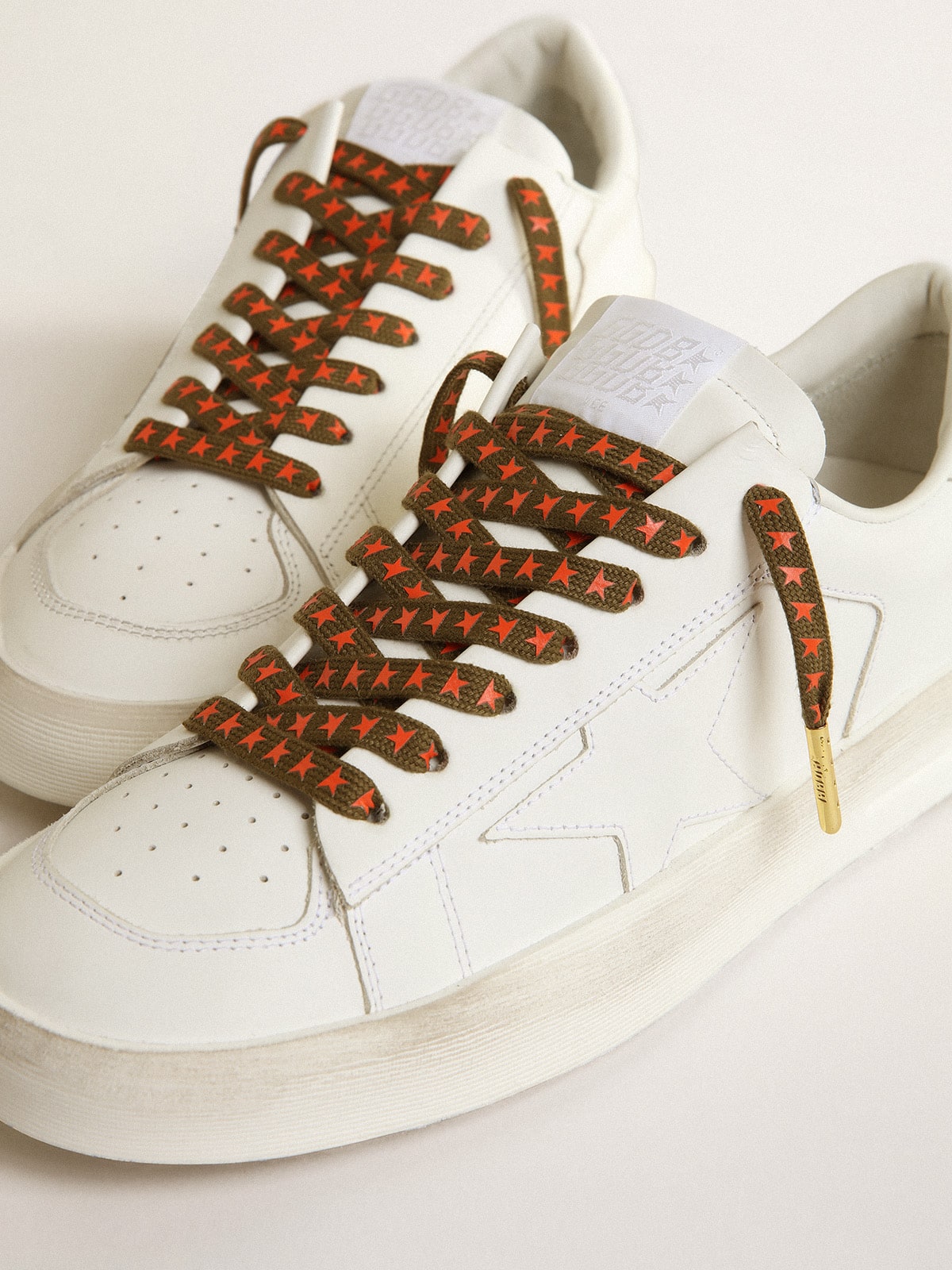 Military-green laces with contrasting orange stars | Golden Goose