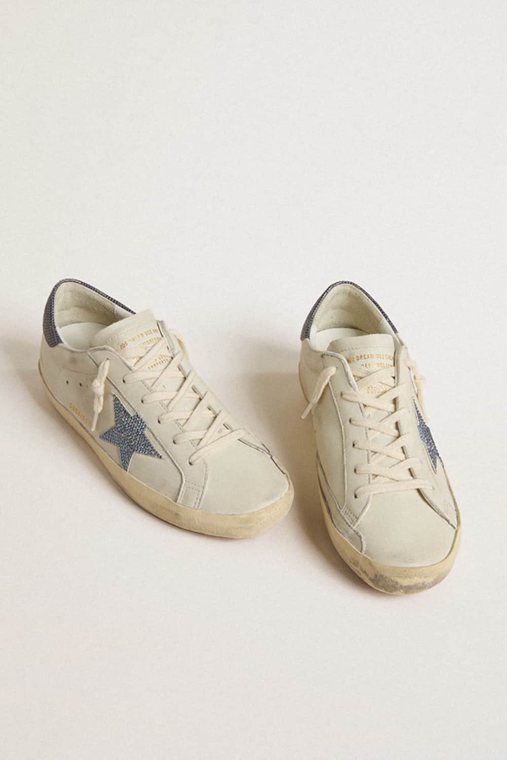Super-Star LTD with blue leather star and detail with chains and pearls ...