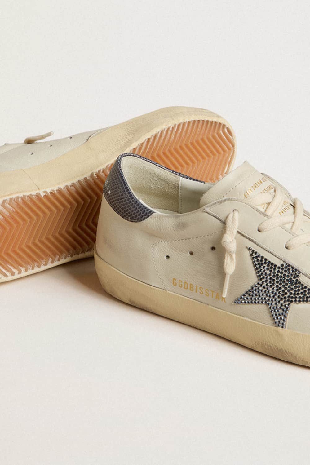 Super-Star LTD with blue leather star and detail with chains and pearls ...