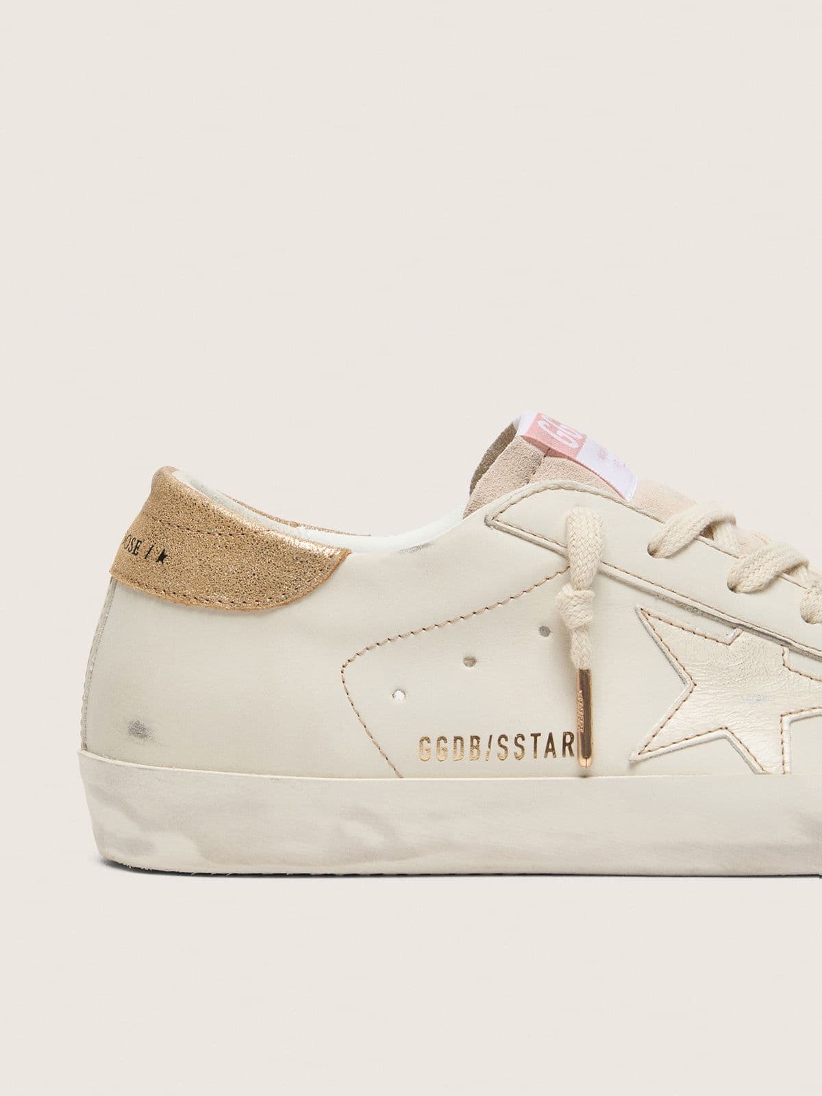 Women’s Super-Star in worn white leather with tone-on-tone star